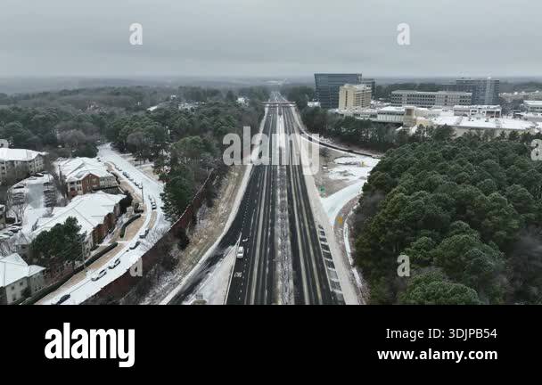 Roadway views over a snow and ice covered North Hills, in Raleigh ...