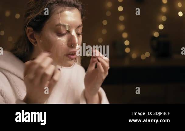 Young Woman Applying Moisturizing Hyaluronic Face Mask Before Sleeping ...