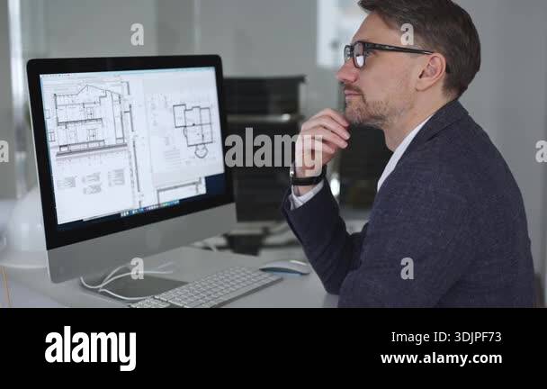 Architect man drawing construction plans on computer, designing new ...