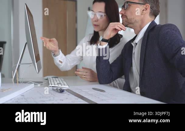 Professional architect team discussing construction project plans and ...