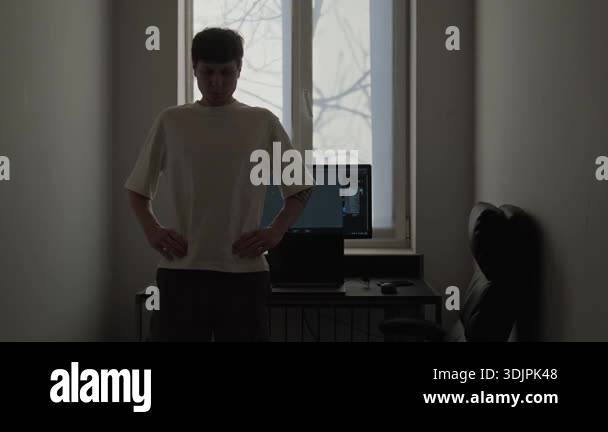 Freelancer stretching in home office during work break, remote work ...