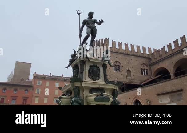 The magnificent bronze statue of Neptune holding a trident on top of ...