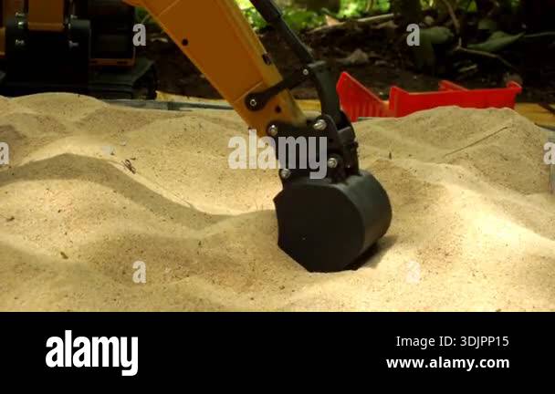Toy Excavator Digging and Moving Sand. Suitable for education, kids ...