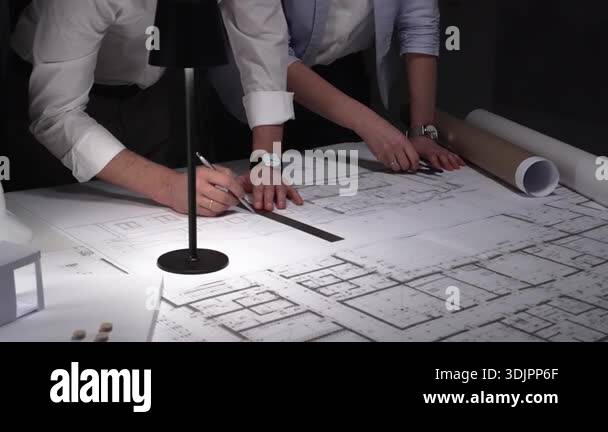 Professional architects and engineers working together on architectural ...