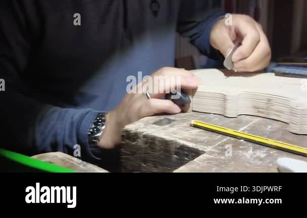 Cremona, Italy - Februrary 18th 2022 A skilled artisan uses precision ...