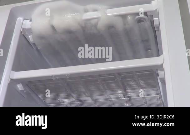 iced froster defrosting, icy fridge cleaning Stock Video Footage - Alamy