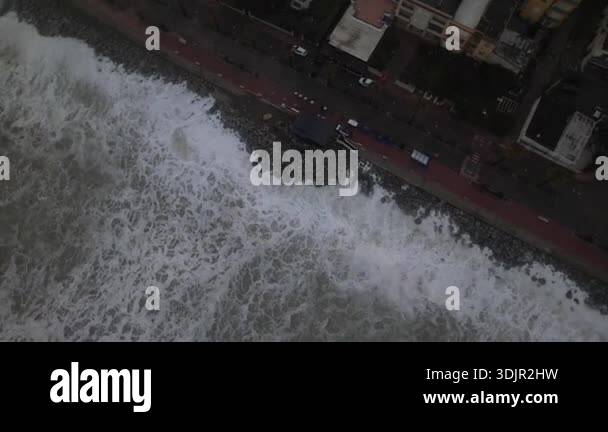 Cyclone-induced waves, coastal town. Drone footage captured a powerful ...
