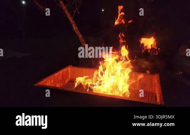 Cozy Night Bonfire in a Metal Fire Pit Outdoors for Family and Friends ...