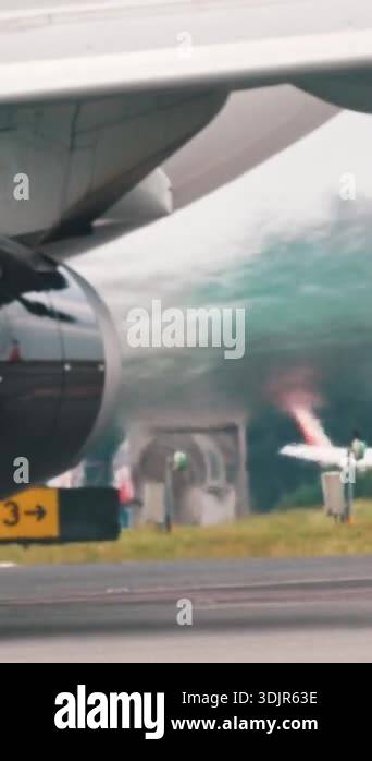 Jet engine exhaust blows red smoke during testing on an airfield Stock ...