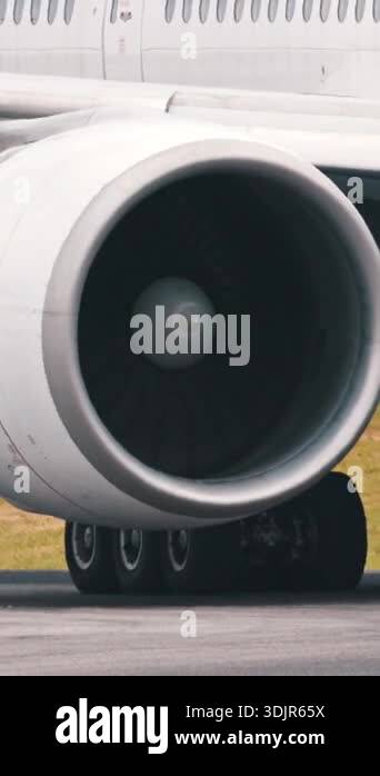 Engine and landing gear of a modern passenger airplane extending while ...