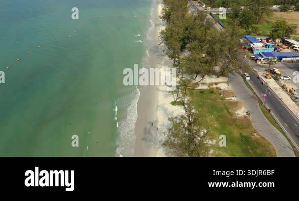 Aerial view of a white sand beach with turquoise water and a coastal ...