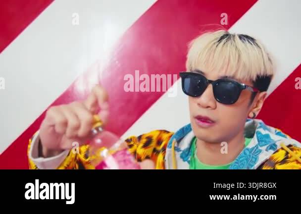 High-energy close-up of a stylish guy in sunglasses and leopard print ...