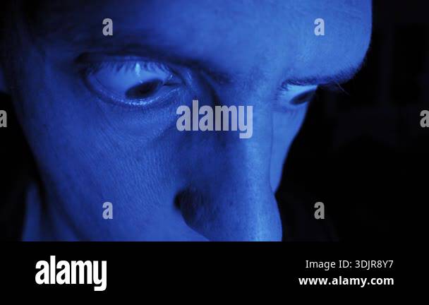 Caucasian male face stares with wide eyes and exaggerated expression ...