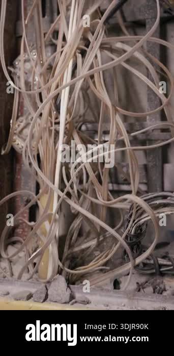 Chaotic bundle of transparent speaker wires and white cables hangs ...