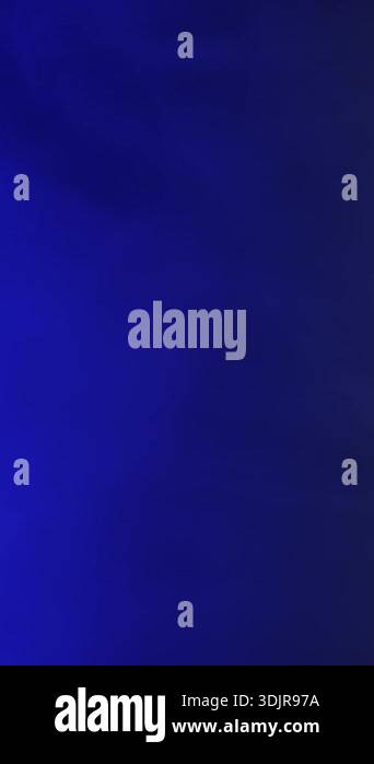 Dark green and deep blue colors blend and shift in a soft, abstract ...