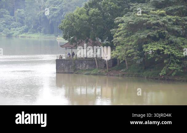Bali, Indonesia - December 26th 2025 : People fishing around Water Dam ...