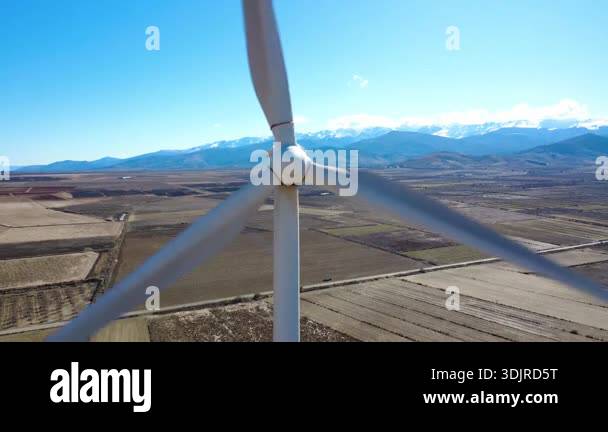 Close up aerial view of a wind turbine generating renewable energy with ...