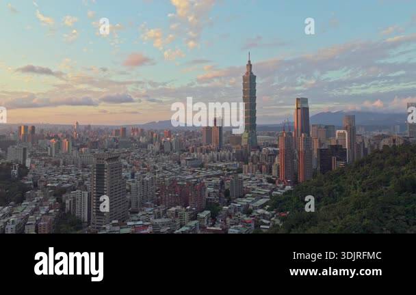 City skyline featuring tall buildings and mountains. Taipei, Taiwan ...