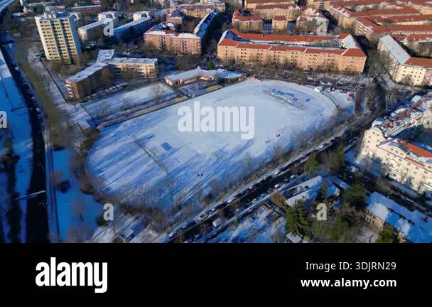 German capital city landscape with a snow covered football pitch and ...