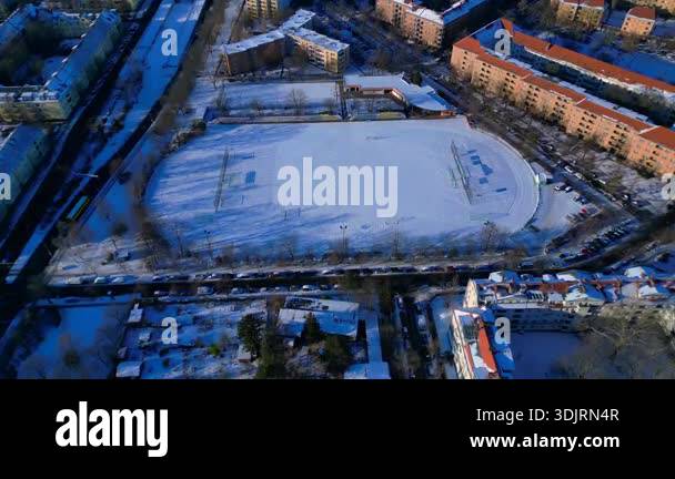 German capital city landscape with a snow covered football pitch and ...