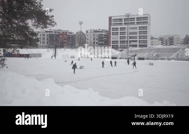 Mikkeli, Finland - January 14, 2026 - People play ice hockey on an ice ...
