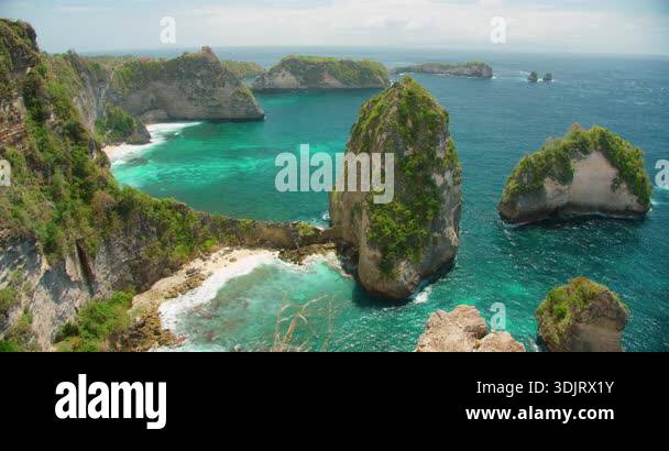 Aerial view of turquoise ocean water and rugged cliffs at Diamond Beach ...