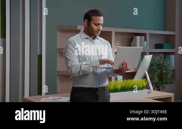 Happy Indian Arabian business man smiling looking at camera working ...