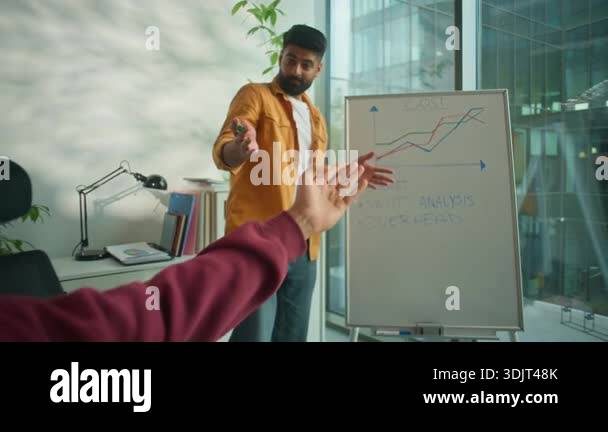 Arabian businessman boss lead presentation in office pointing at stats ...