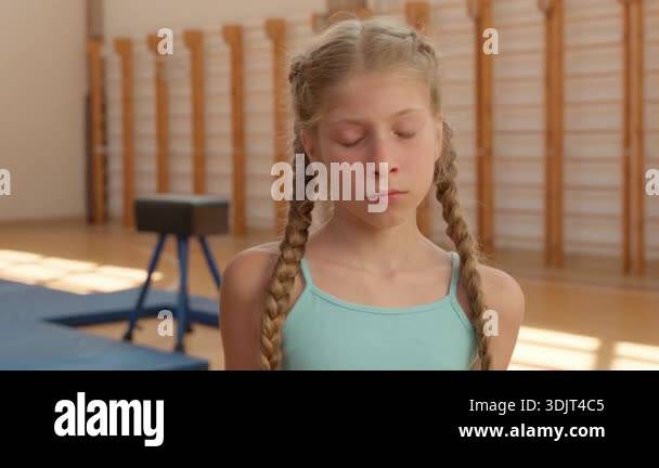 Stressed disappointed Caucasian little girl looking at camera after ...