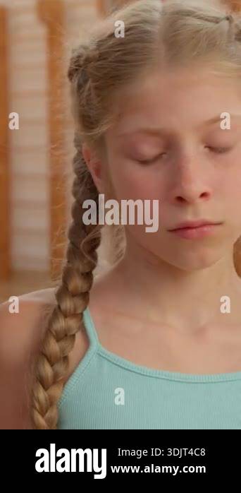 Stressed disappointed Caucasian little girl looking at camera after ...
