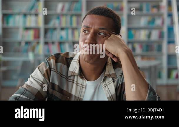 Bored unhappy African American man male student in library tired guy ...