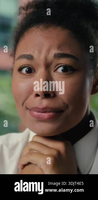 Portrait African American business woman afraid scared looking at ...