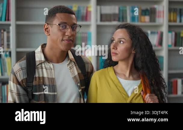 Two students serious ethnic African American man Latino Hispanic woman ...
