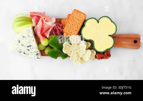 St Patricks Day theme charcuterie board against a white marble ...