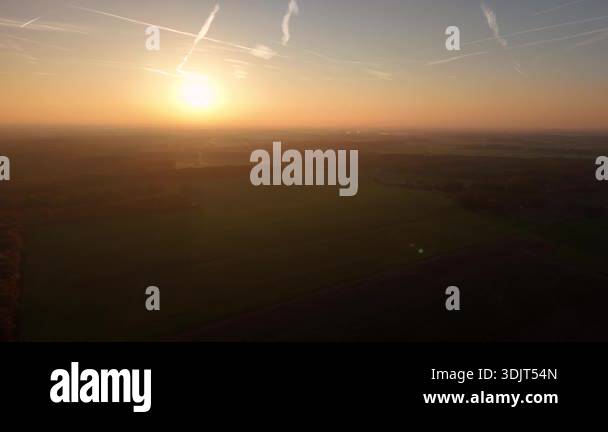 Dramatic Sunrise Over Open Plains With Contrails Sun Lifts Above ...