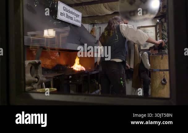 Blacksmith Artisan Working At Lit Forge With Glowing Metal And Roaring ...
