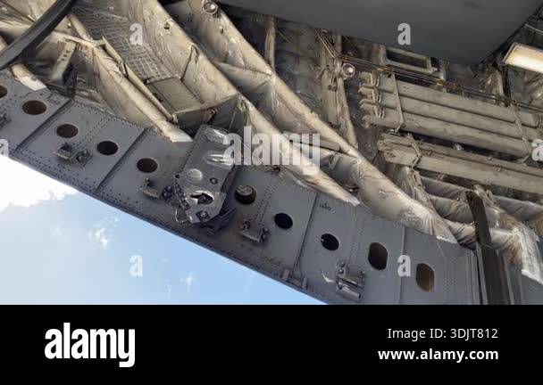 Close-up view shows the underside cargo door structure of a large ...