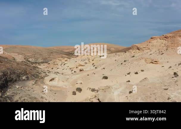 Drone view over the Enchanted Ravine desert in Fuerteventura featuring ...