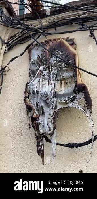 Damaged and melted plastic electrical wiring and junction box on a ...