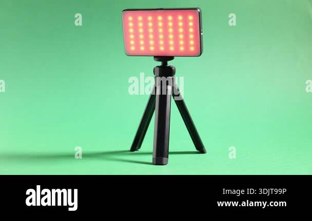LED lamp switching colors against turquoise background Stock Video ...