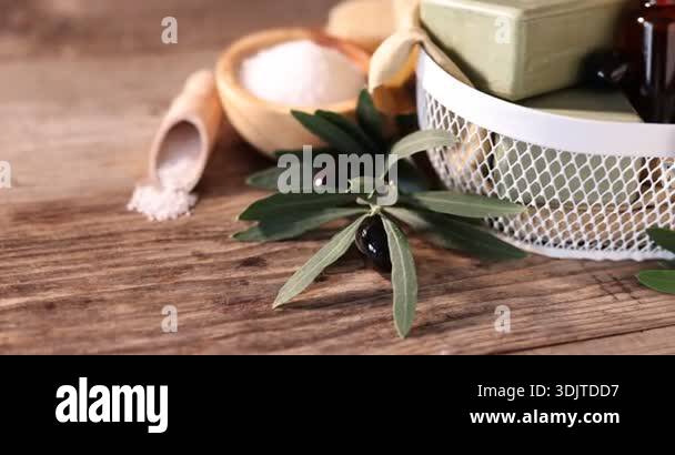 Natural soap bars, olives, oil and different cosmetic products on ...