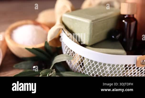 Natural soap bars, olives, oil and different cosmetic products on ...