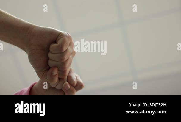 People joining hands together indoors, bottom view. Team building Stock ...
