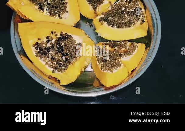 close up of Carica papaya slices with seeds and vibrant flesh Stock ...