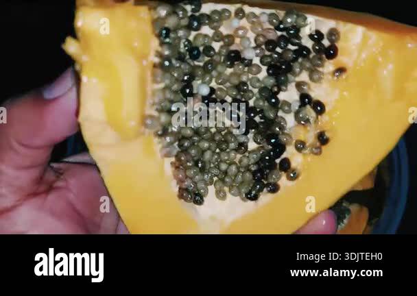close up of Carica papaya slices with seeds and vibrant flesh Stock ...