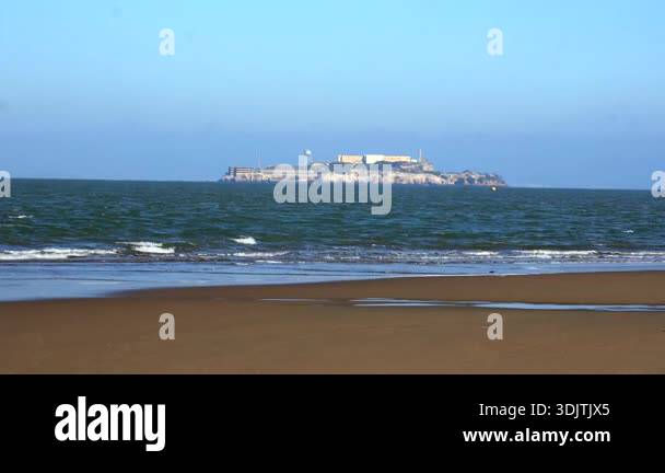 Panoramic landscape view of Alcatraz Island prison across blue ocean ...