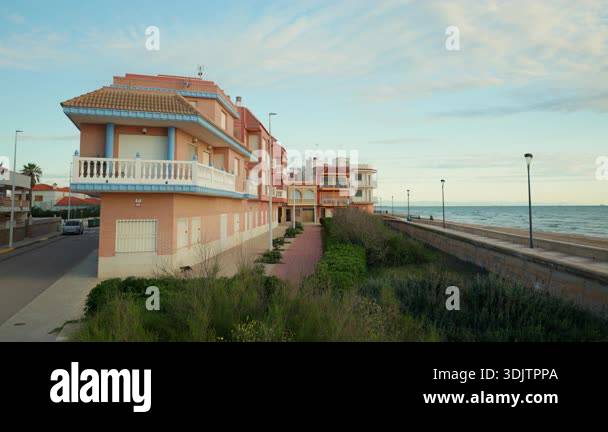 Mediterranean waterfront with colorful residential buildings on ...