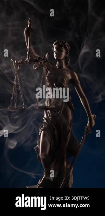 Bronze Lady Justice statue holding scales and sword surrounded by ...
