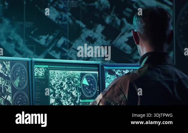 Soldier in a dimly lit military control room, intensely focused on ...