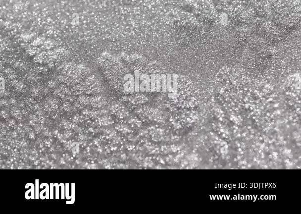 Rotating view of silver metallic paint texture showing granular sandy ...